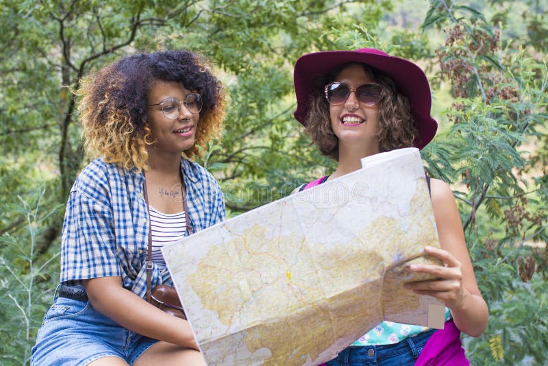 Girls reading map stock photo. Image of outdoor, smile - 105772148