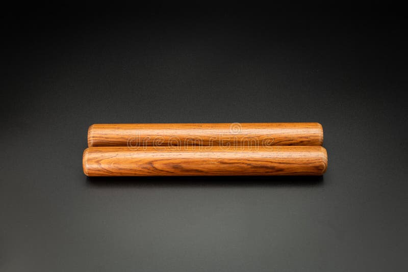 A Pair of Wooden Claves Lying on a Black Underground Stock Image ...