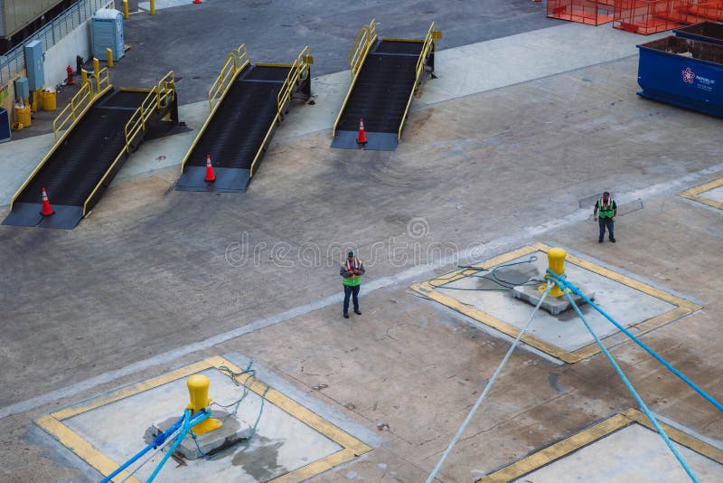 Pair of Workers are Hard at Work Preparing Ramps for a Cruise Ship in a Busy Port Editorial ...