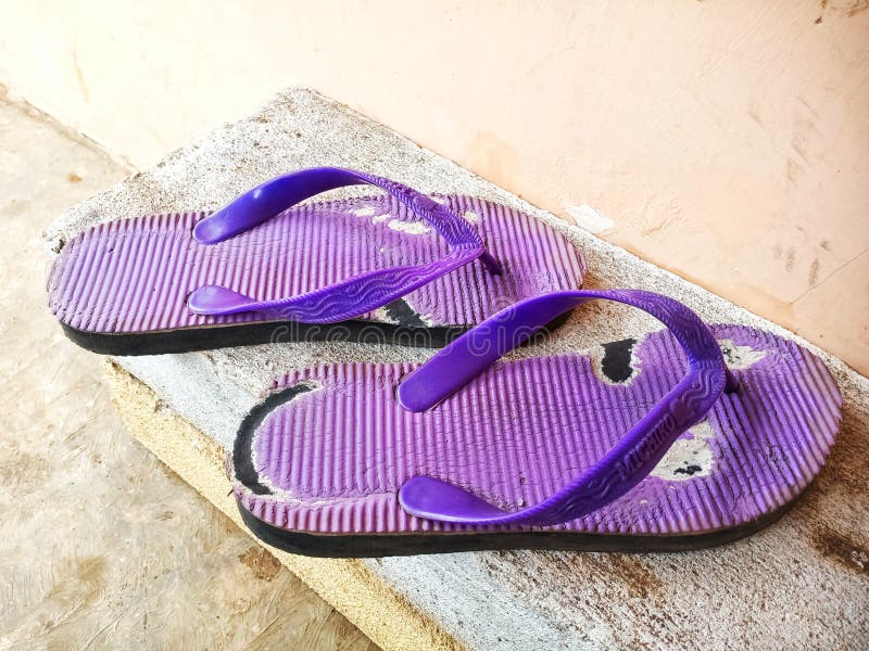 A Pair of Worn-out Flip-flops in Front of the House Stock Image - Image ...
