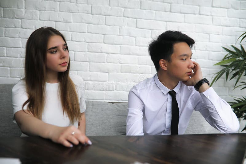 A Pair of Young People Talking at the Office Stock Image - Image of ...