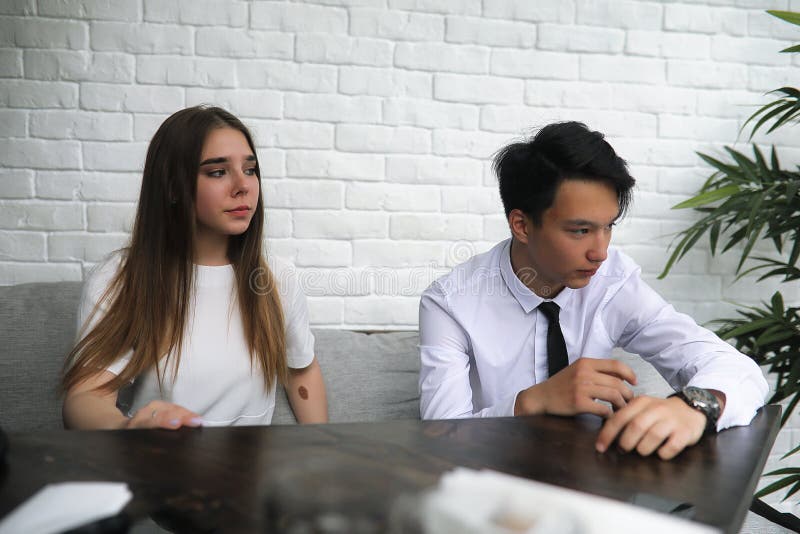 A Pair of Young People Talking at the Office Stock Photo - Image of ...