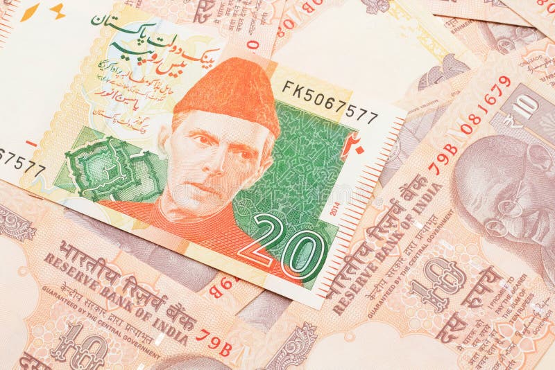 A Pakistani Rupee Bank Note with Indian Twenty Rupee Bank Notes Stock ...