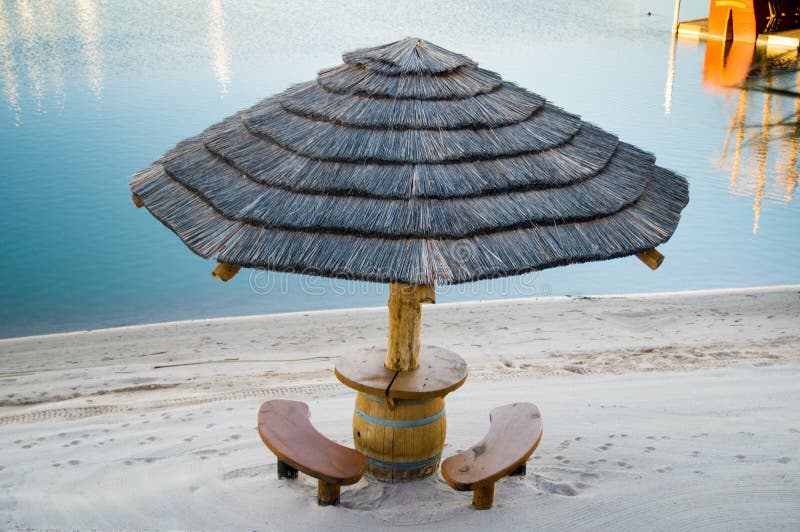 Palapa Picnic Table and Benches Stock Photo - Image of straw, water ...