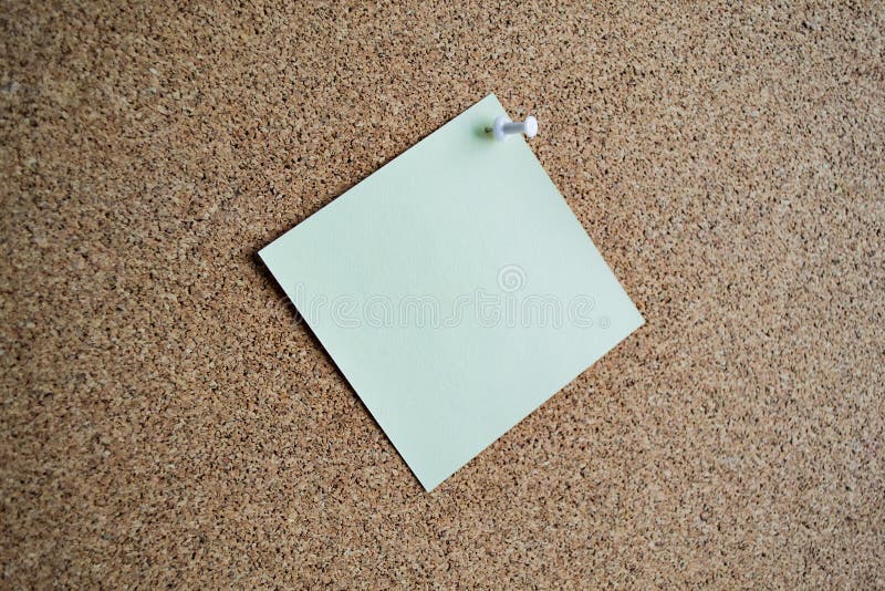 Pale Green Paper Note on a Cork Board, Attached with a White Pushpin ...