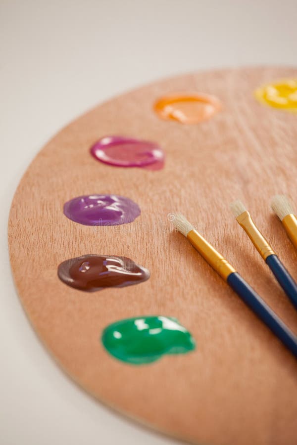 Palette with Multiple Colors and Paint Brushes Stock Image - Image of ...