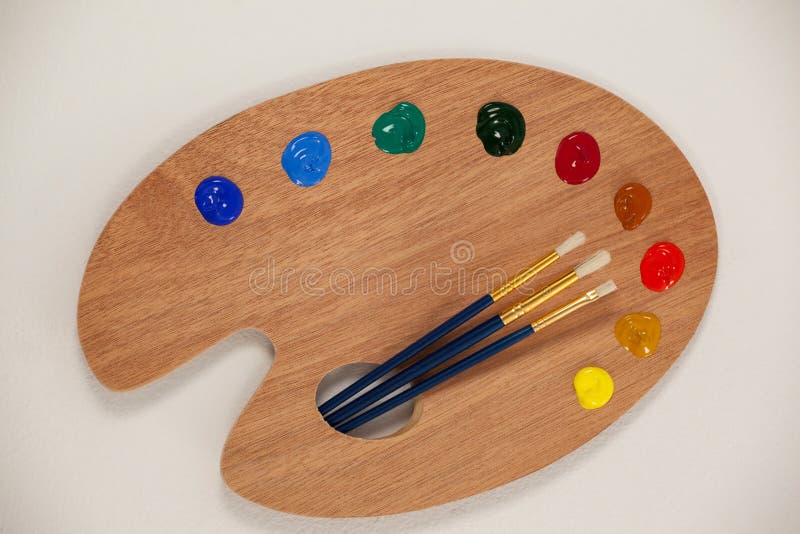 Palette with Multiple Colors and Paint Brushes Stock Photo - Image of ...