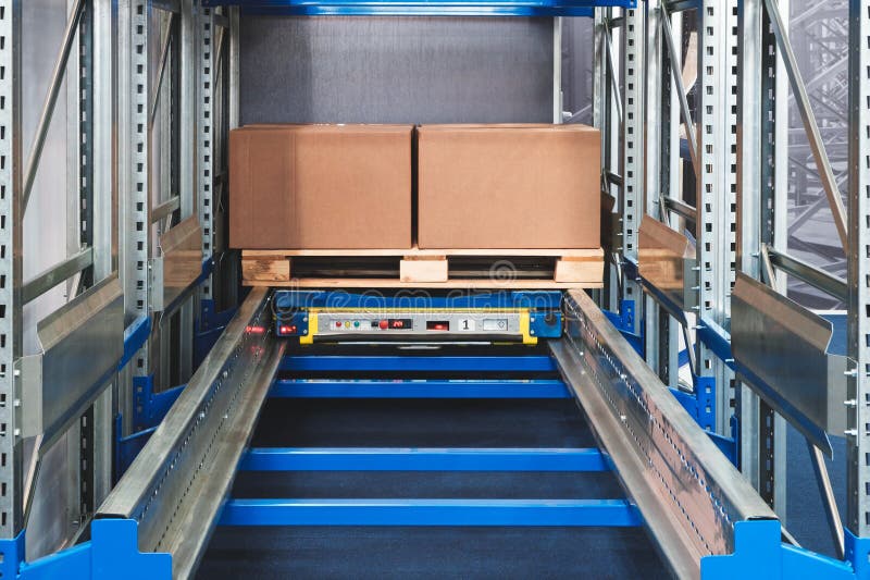 A Pallet of Boxes is Being Moved by a Conveyor Stock Image - Image of ...