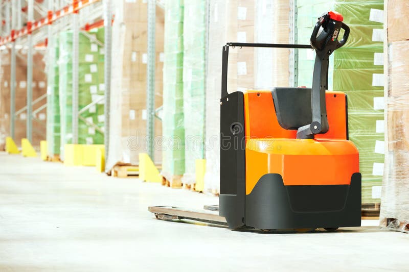 Pallet truck at warehouse stock photo. Image of stacker - 63111650