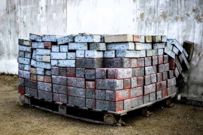 Stack of Weathered Bricks on a Wooden Pallet with Shades of Gray and ...