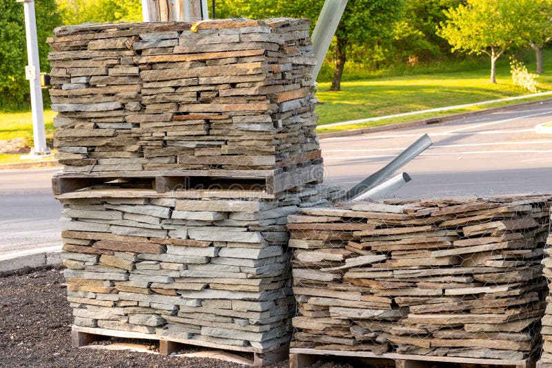 Pallets with Natural Facing Stone and Cobblestones Stock Image - Image ...