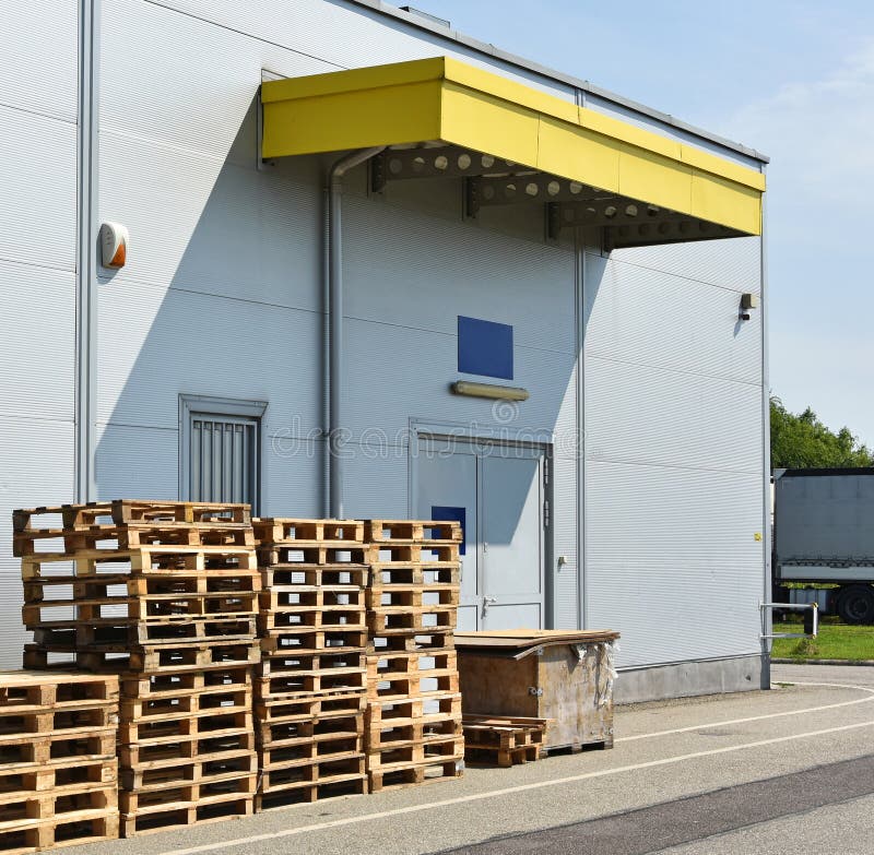 Pallets Next To the Warehouse Stock Photo - Image of window, park: 81835334