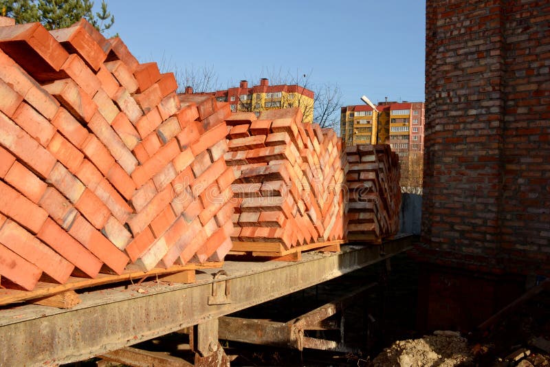 Pallets and Packages of Fresh Red Bricks at a Construction Site ...