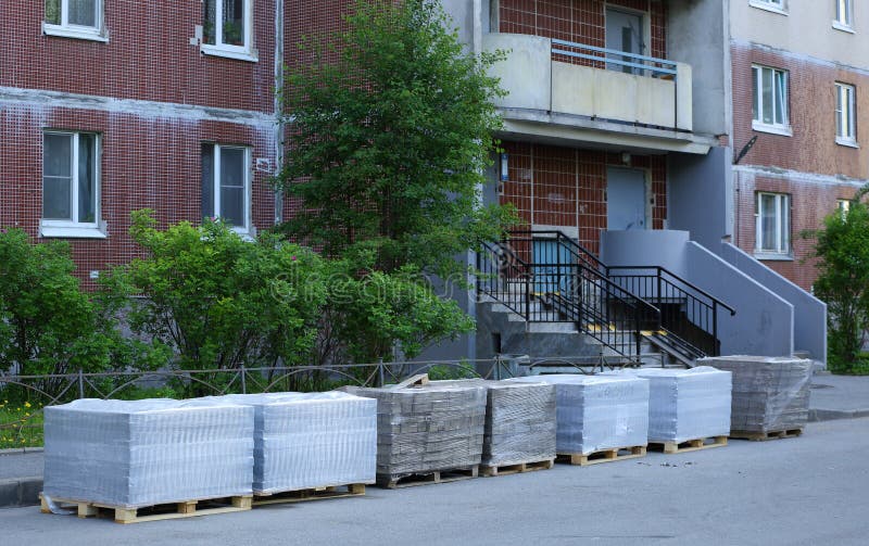 Pallets with Paving Slabs and Curbs in Plastic Wrap are Prepared for ...