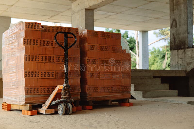 Pallets with Red Bricks at the Stage of Construction in a New Building ...