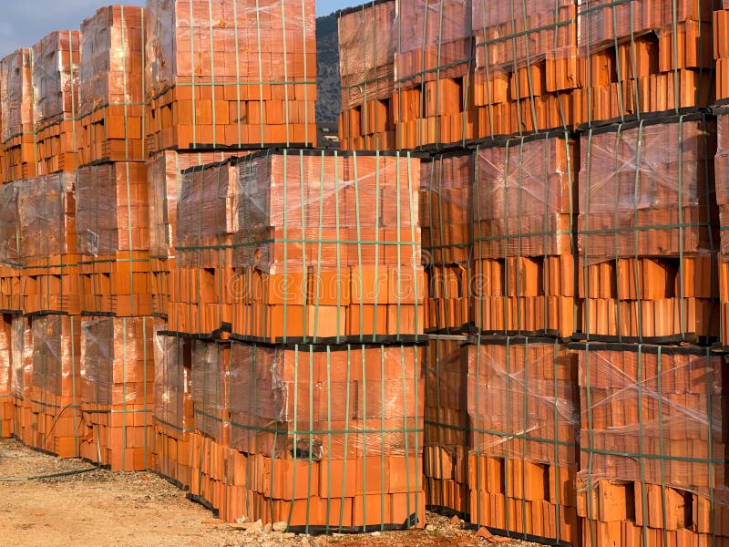 Pallets of Red Bricks Wrapped in Polyethylene and Stand One on the ...