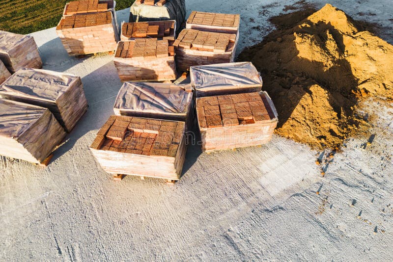 Pallets with Red Ceramic Bricks on the Roof of a Building Under ...