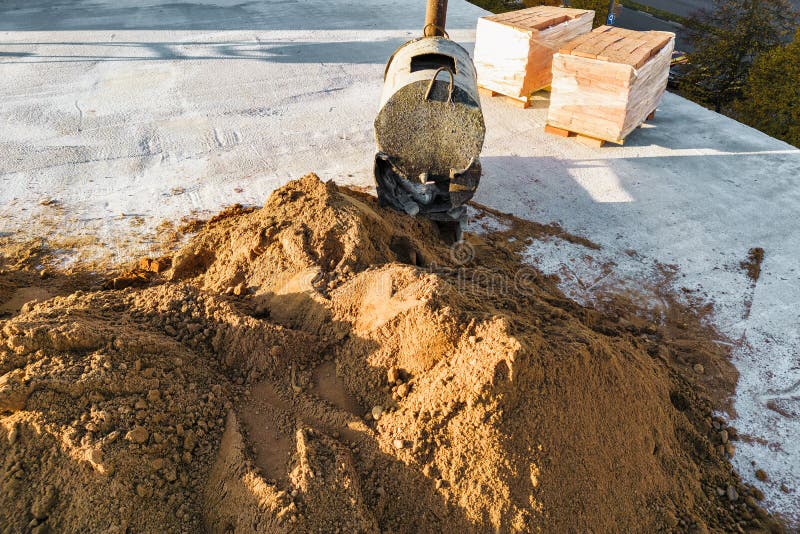 Pallets with Red Ceramic Bricks on the Roof of a Building Under ...