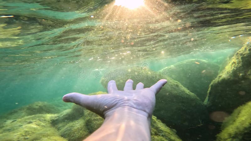 Hand Underwater Illuminated by Sun Rays Stock Footage - Video of touch ...