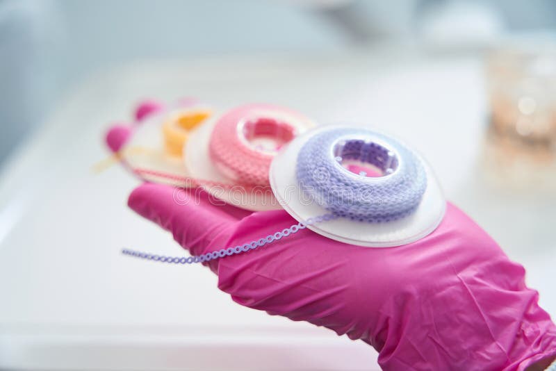 On Palm are Three Multi-colored Spools of Consumables Stock Image ...