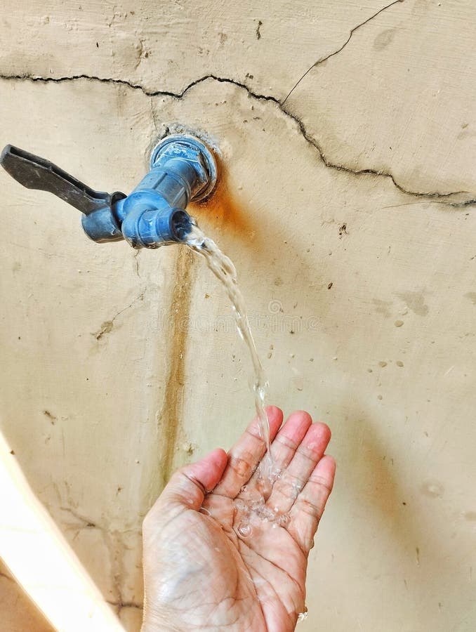 A Palm Under the Running Water Tap Stock Photo - Image of running ...