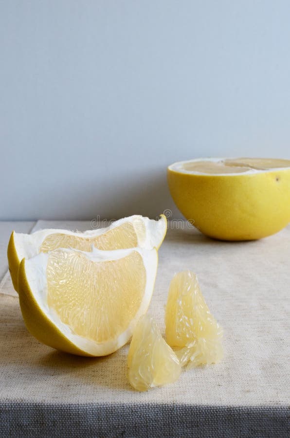 Pamela Fruit, Cut into Pieces, on a White Background Stock Image ...