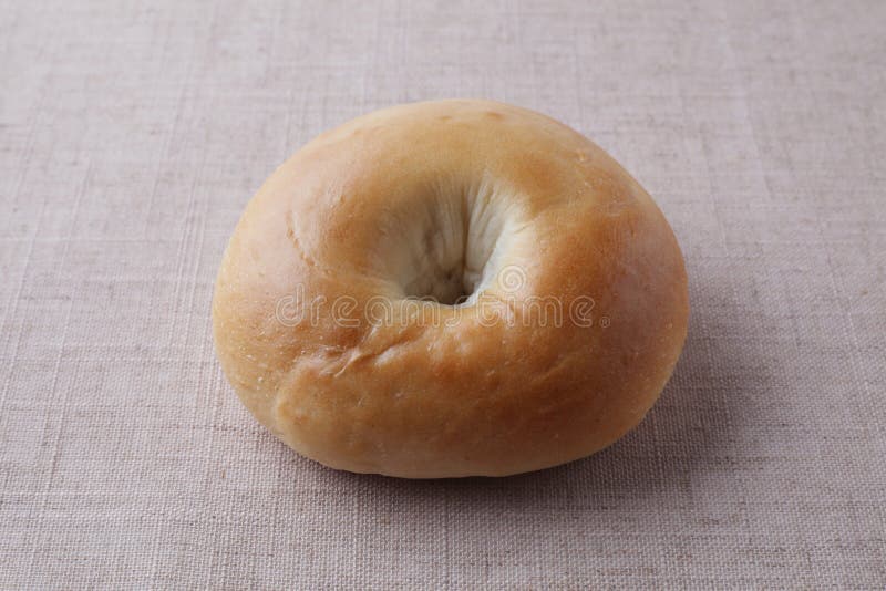 Pan De Bagel Liso Aislado En Tela De Mesa Imagen de archivo - Imagen de ...