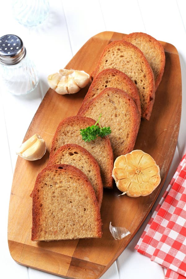 Pan fried bread and garlic stock photo. Image of cutting - 26609022