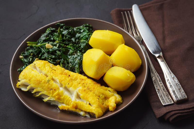 Pan-fried Cod Fillet, Served with Spinach and Potatoes. Stock Image ...