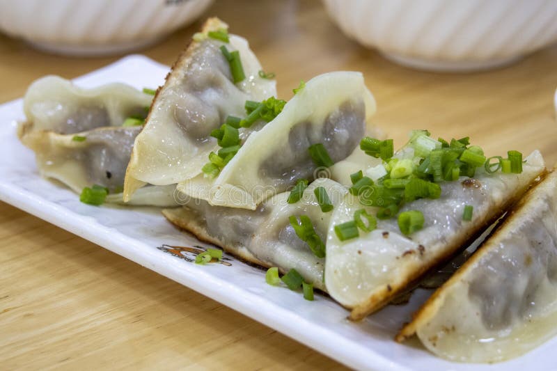 Pan Fried Dumplings with Spring Union Stock Photo - Image of chinese ...