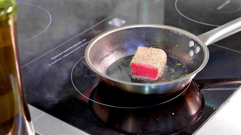 Pan-fried Fish, the Marlin Fillet on the Steaming Frying Pan. Stock ...