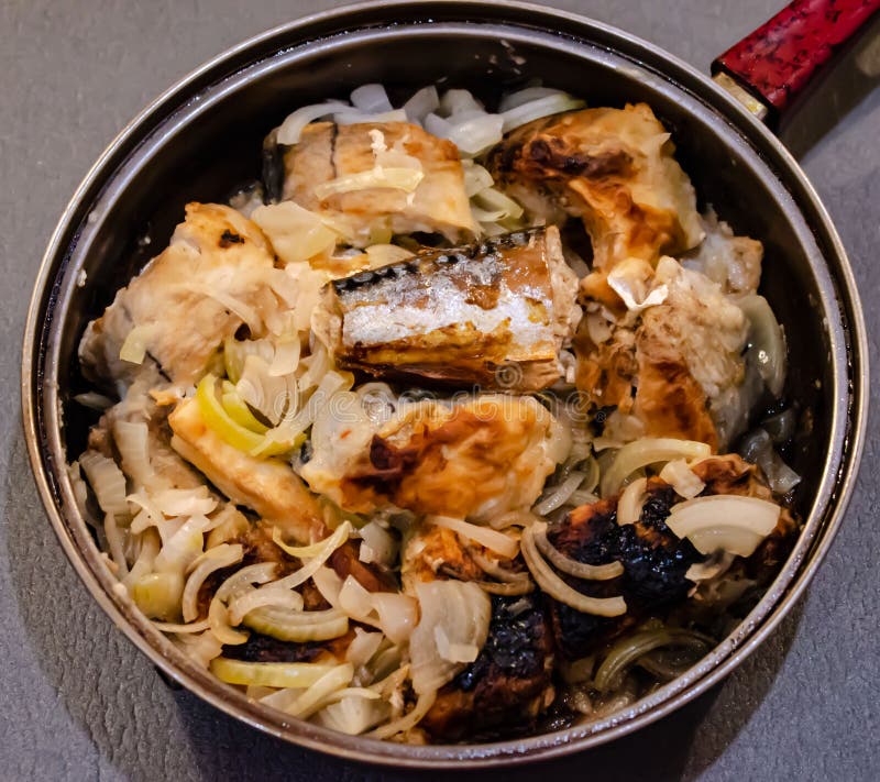 Pan-fried fish with onions stock photo. Image of culinary - 234282380