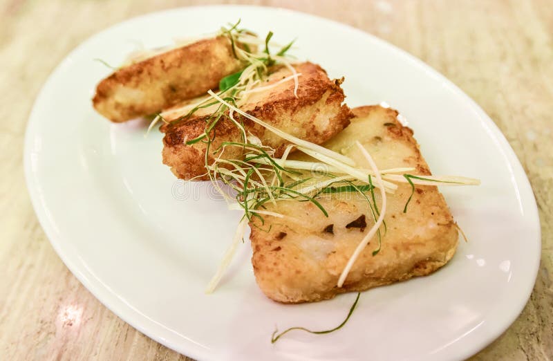 Pan-fried turnip cake stock photo. Image of dried, cake - 101990010