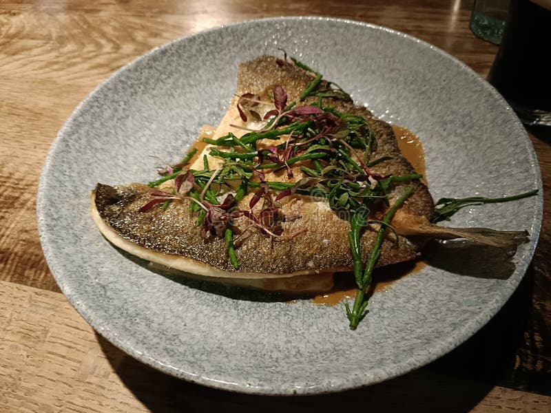 Pan fried whole sea bream stock photo. Image of bream - 352550990