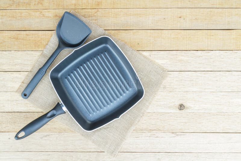 Pan and Ladle on Wood Table Stock Photo - Image of view, cuisine: 74522778
