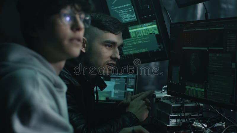 Male Hackers Using Computers and Speaking Stock Photo - Image of night ...