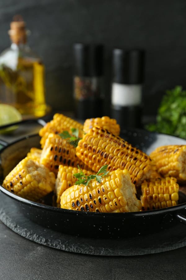 Pan with Tasty Grilled Corn on Dark Grey Table Stock Photo - Image of ...