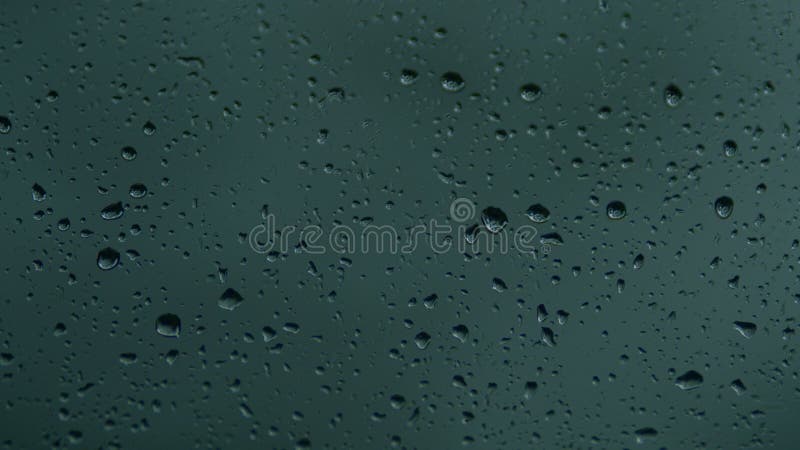 Water Droplets on Glass. Heavy Rain Storm into the Window. Pan. Stock ...