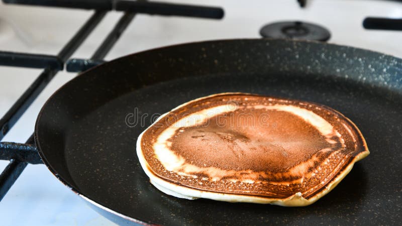 Pancake Burn on the Pan, Homemade Pancake Fried in a Pan in the Kitchen ...