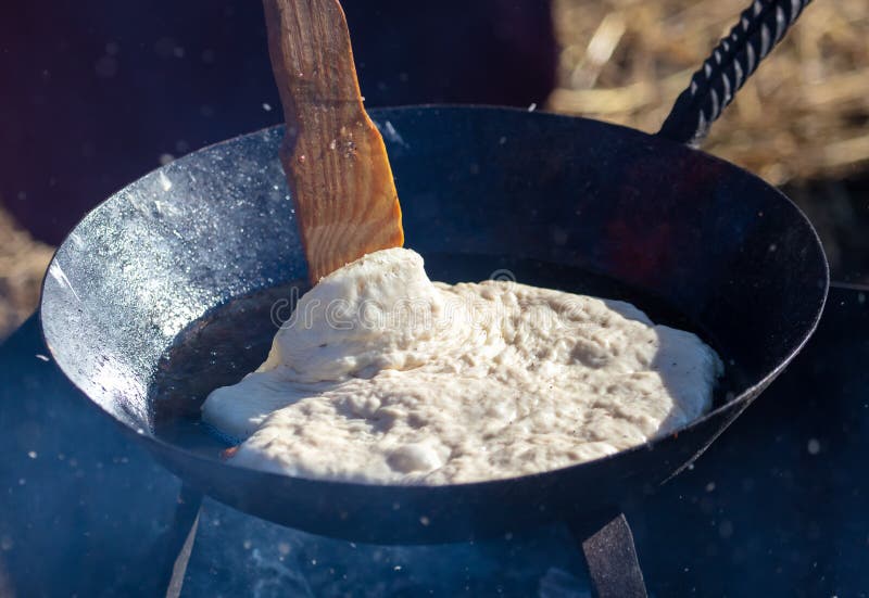 Pancake is fried in a pan stock photo. Image of grille - 201375654