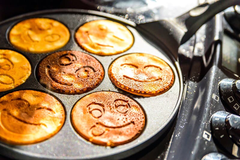 Pancake Frying Pan with Smile Face Pancake Cooking on Cooker in Kitchen ...