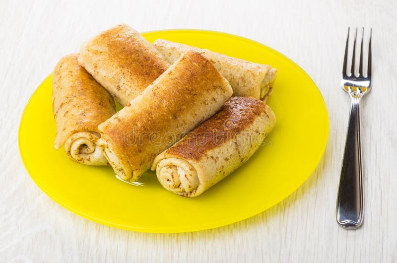 Pancake Rolls with Stuffed in Yellow Plate and Fork Stock Photo - Image ...