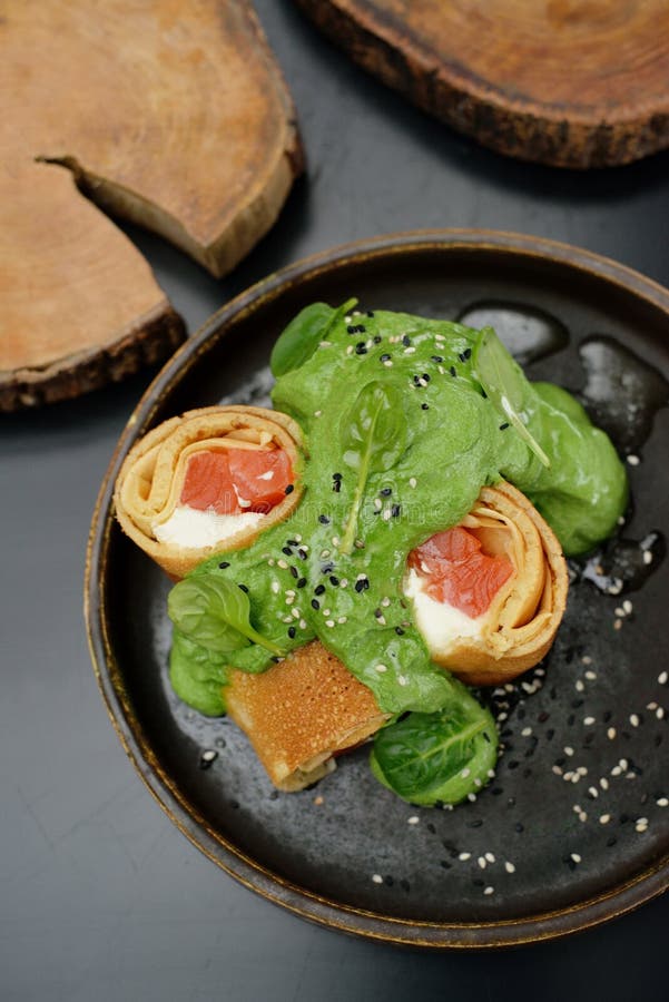 Pancakes with Fish Salmon, Cheese and Spinach. Restaurant Menu Stock ...