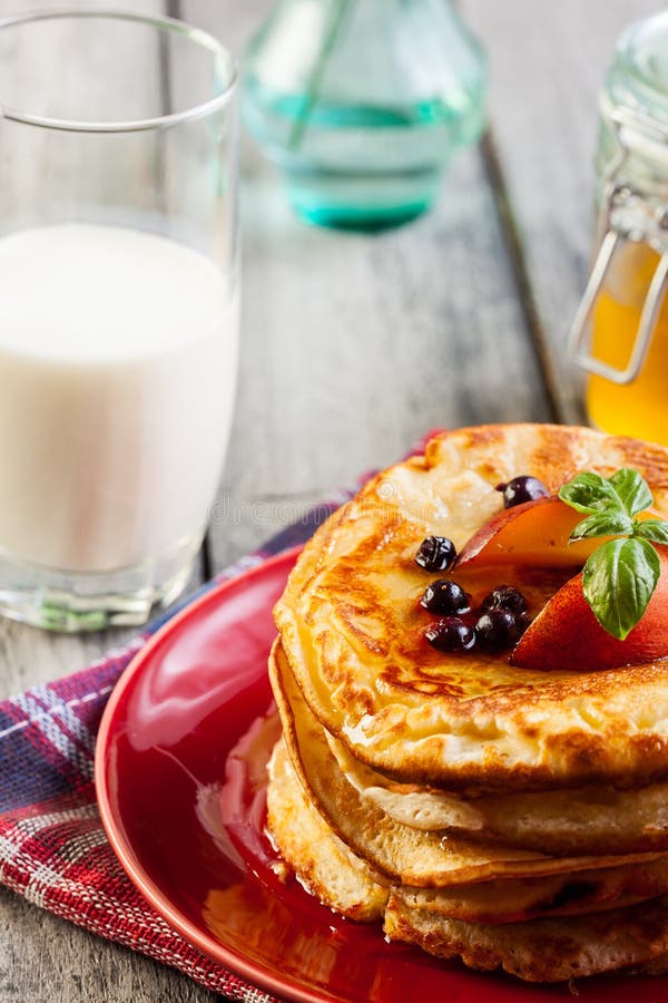 Pancakes with Honey, Fruit and Glass of Milk Stock Image - Image of ...
