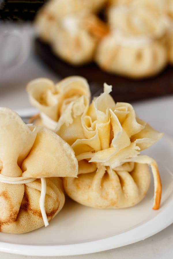 Pancakes Stuffed with a Bag on a White Plate with Meat Filling Tied ...