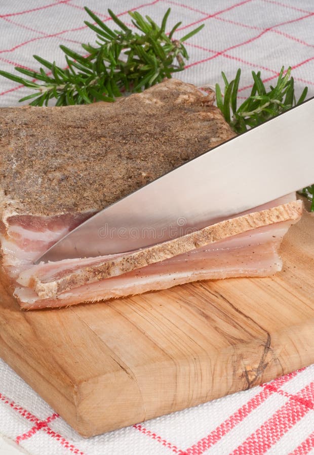 Pancetta being sliced stock image. Image of slowfood - 18874303