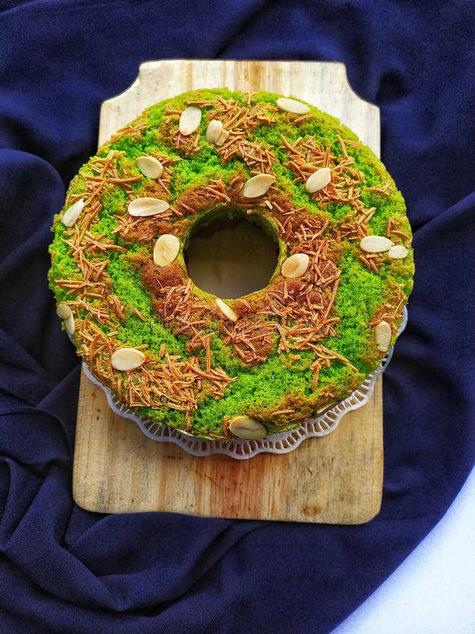 Pandan Cake with Almond and Cheese Topping Stock Photo - Image of food ...