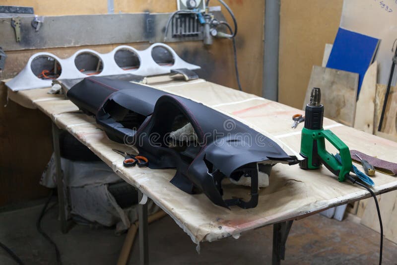 The Panel of the Car Interior on a Workbench in a Workshop for Repair ...