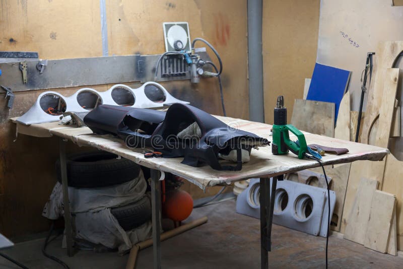 The Panel of the Car Interior on a Workbench in a Workshop for Repair ...