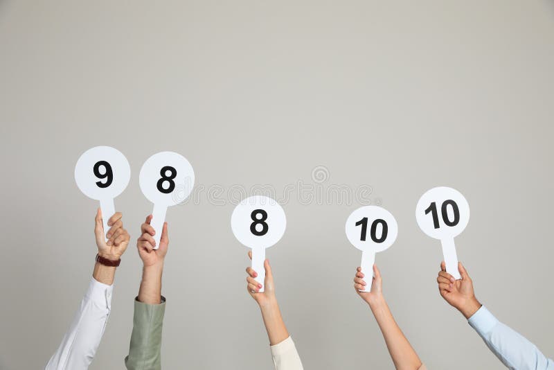 Panel of Judges Holding Different Score Signs on Beige Background ...